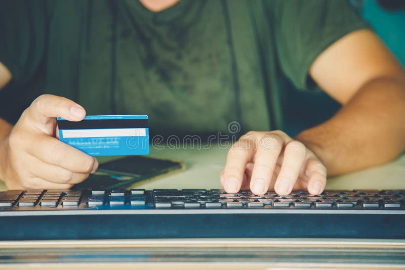 Close Up a Hands Man Holding Credit Card and Use Keyboard Computer ...