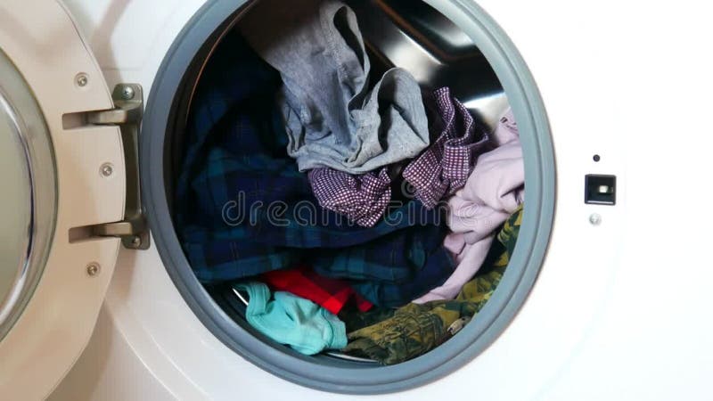 Close-up of the Hands of a Man Opening the Door of a Washing Machine ...