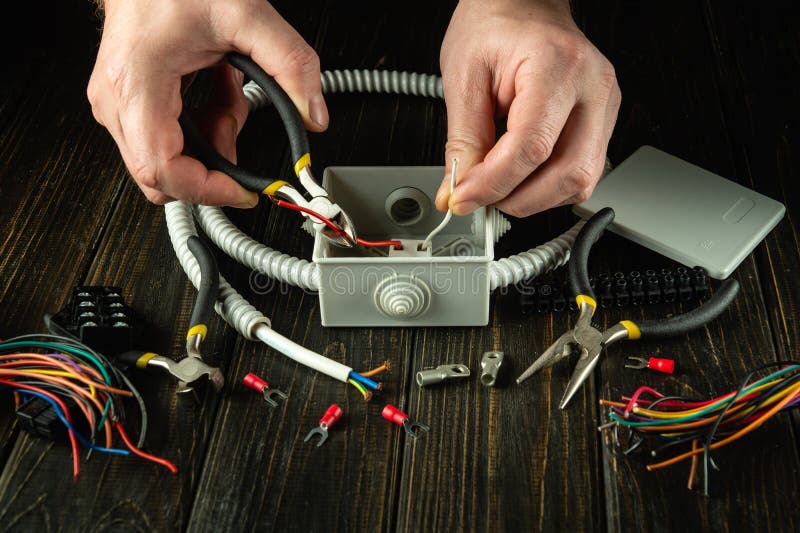 Close-up of the Hands of a Master Electrician during Work. Cutting a ...