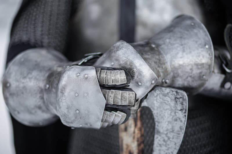 Close-up of the Hands of a Medieval Warrior in Plate Gloves Against the ...