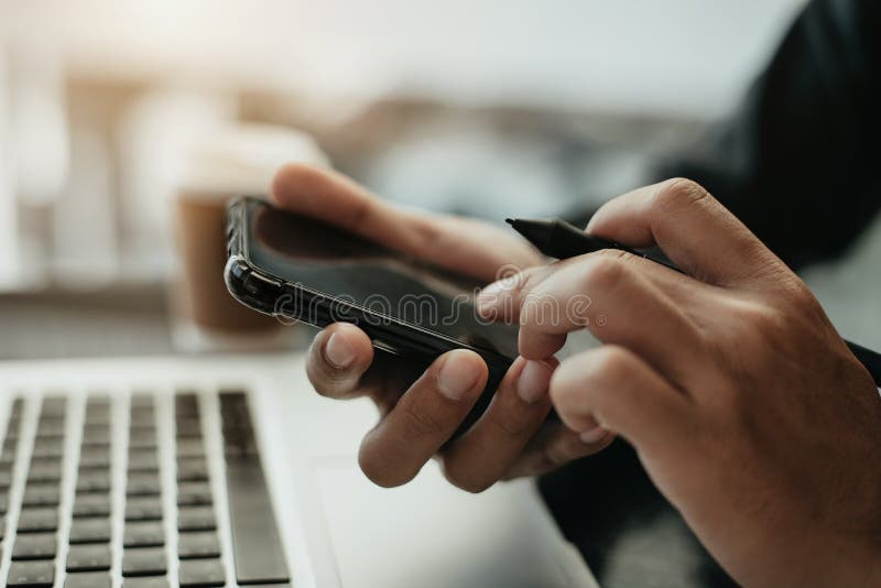 Close Up Hands Multitasking Man Using Smartphone and Laptop Connecting ...