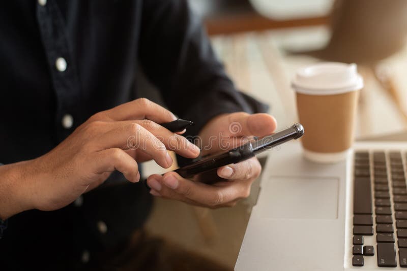 Close Up Hands Multitasking Man Using Smartphone and Laptop Connecting ...