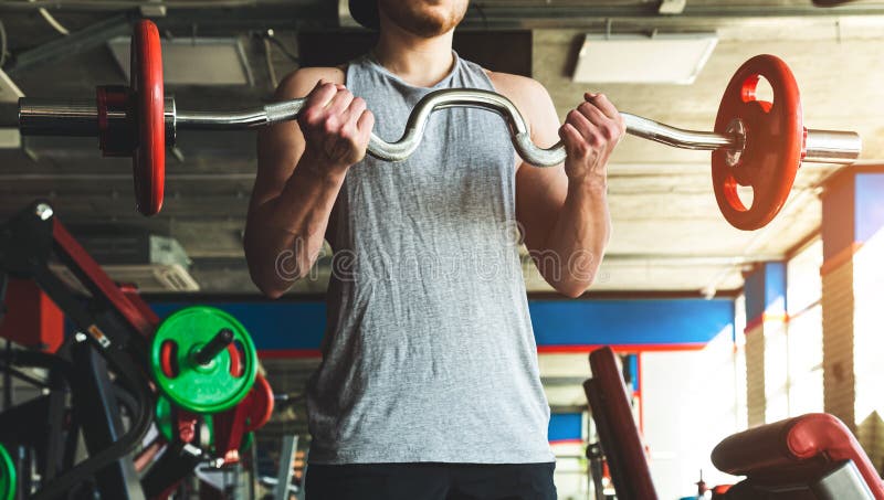 Close-up of the Hands of a Muscular Man Performs Exercises with a ...