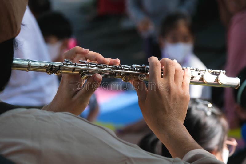 Close-up of the Hands of a Musician Playing the Flute. Hands of Man ...