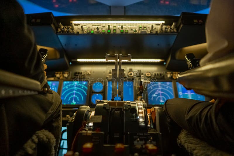 Close-up of the Hands of the Pilots on the Controls of the Aircraft ...