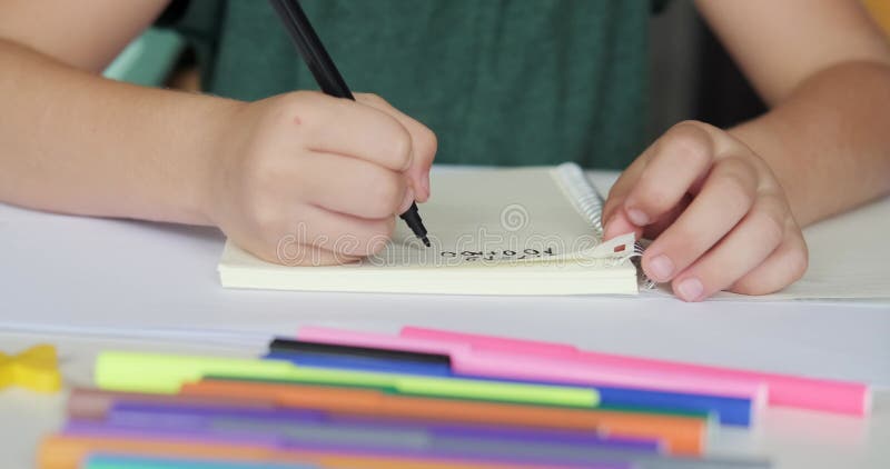 Close-up of the Hands of Preparatory School Boy Doing His Homework at ...