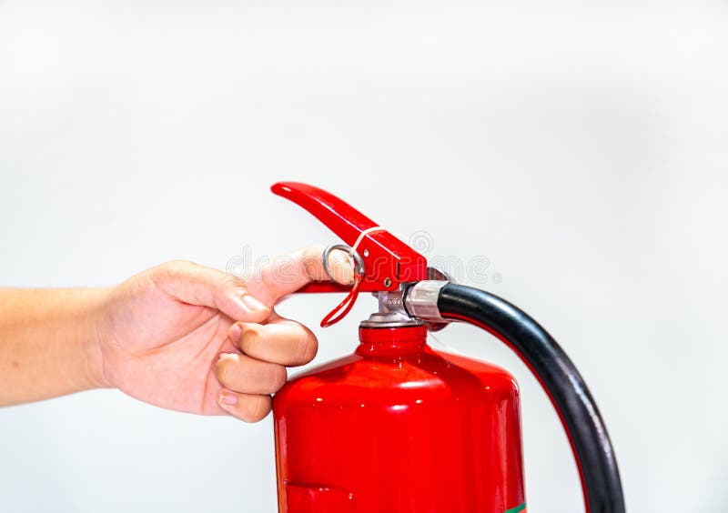 Close Up Hands Pulling Safety Pin of Fire Extinguisher Stock Image ...