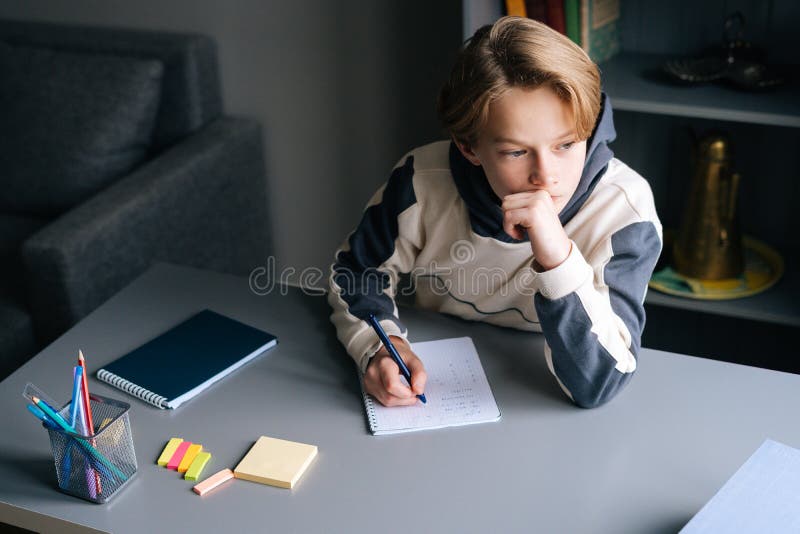 Close-up Hands of Pupil Boy Writing in Notebook Solving Math Equations ...