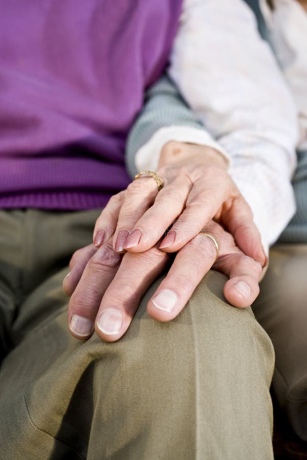 Close-up Hands of Senior Couple Resting on Knee Stock Photo - Image of ...