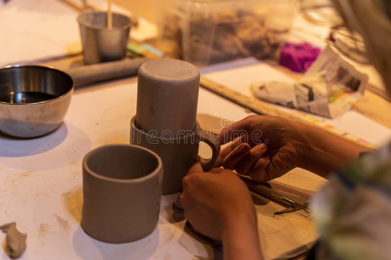 Close-Up of Hands Shaping Clay Cups during Pottery Workshop Stock Image ...