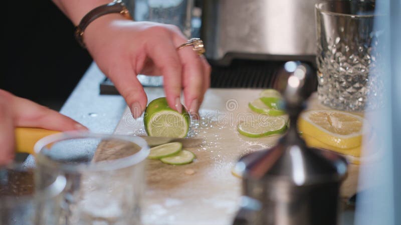 Close-up of Hands Slicing a Lime in the Kitchen Stock Image - Image of ...