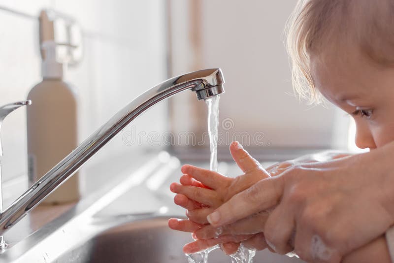 Close Up Hands of a Small Children Washing Hands with Soap and Water ...