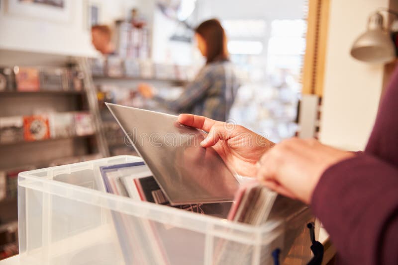 Close-up of Hands Sorting through Records at a Record Shop Stock Image ...