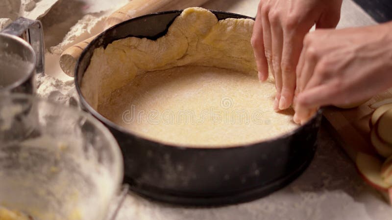 Hands Spreading Dough in a Baking Pan. the Scene Captures the Detailed ...