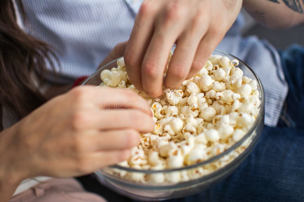 Close Up of Hands Taking Popcorn from Bowl. Stock Photo - Image of ...