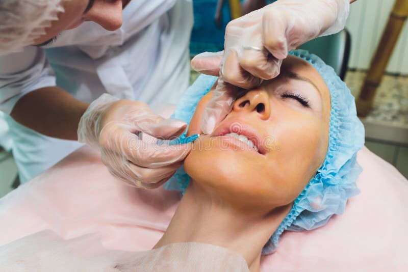 Close Up of a Hands Threading Beautiful Womans Upper Lip. Stock Image ...