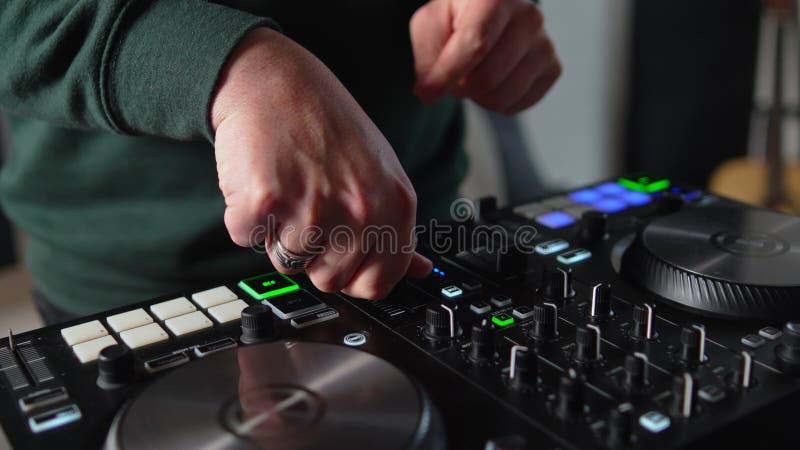 Close Up Hands Turning Knobs and Pushing Buttons on Sound Mixing Board ...