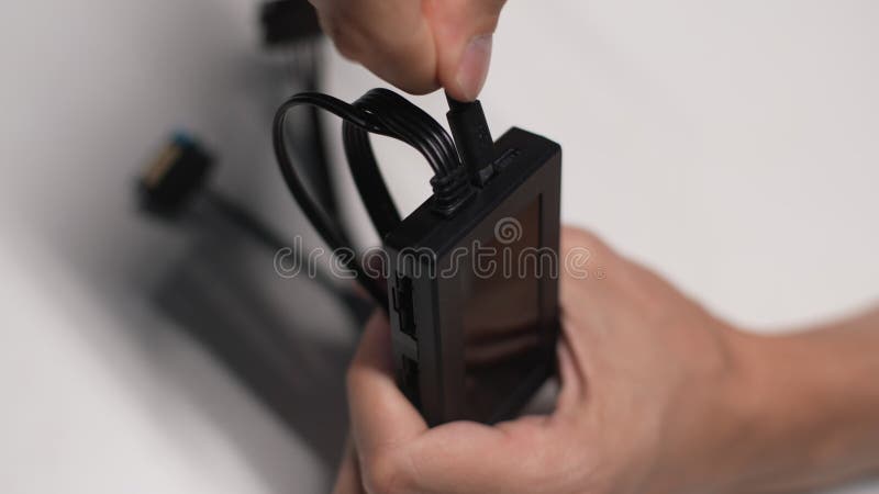 Close-up Hands of Unrecognizable Man Plugging Cables into New Card ...