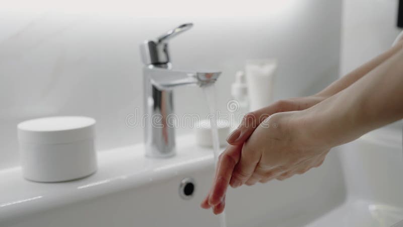 Close-Up of Hands Using Soap Dispenser in Modern Clean Bathroom Stock ...