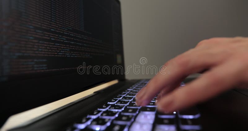 Close Up Hands Of Woman Sitting At Desk Typing Computer Code On Laptop Keyboard Lines Of