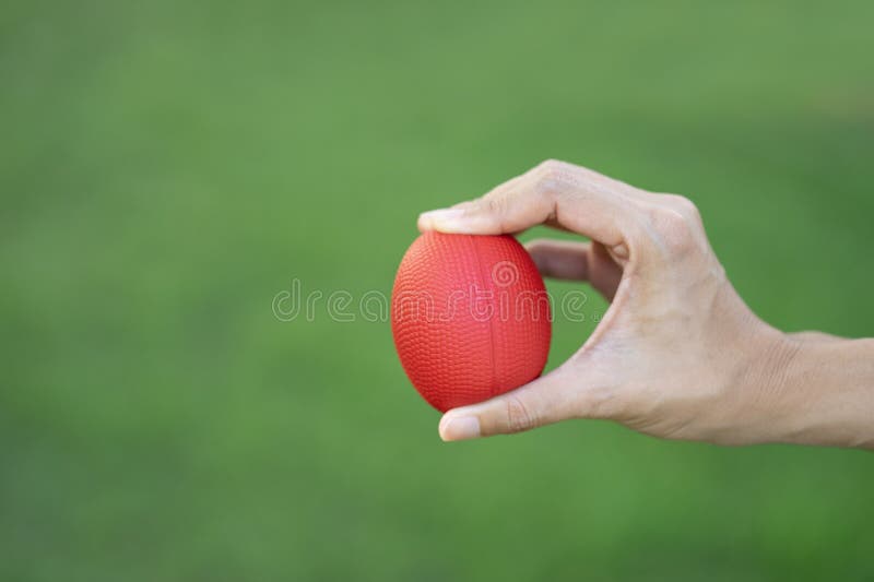 Hands of a Woman Squeezing a Red Stress Ball Stock Image - Image of ...
