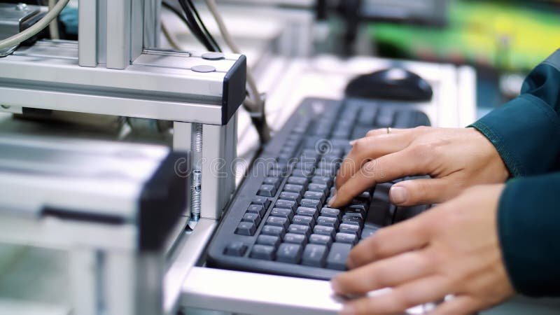 A Close-up, Hands Work on the Keyboard. a Worker at an Enterprise, a ...