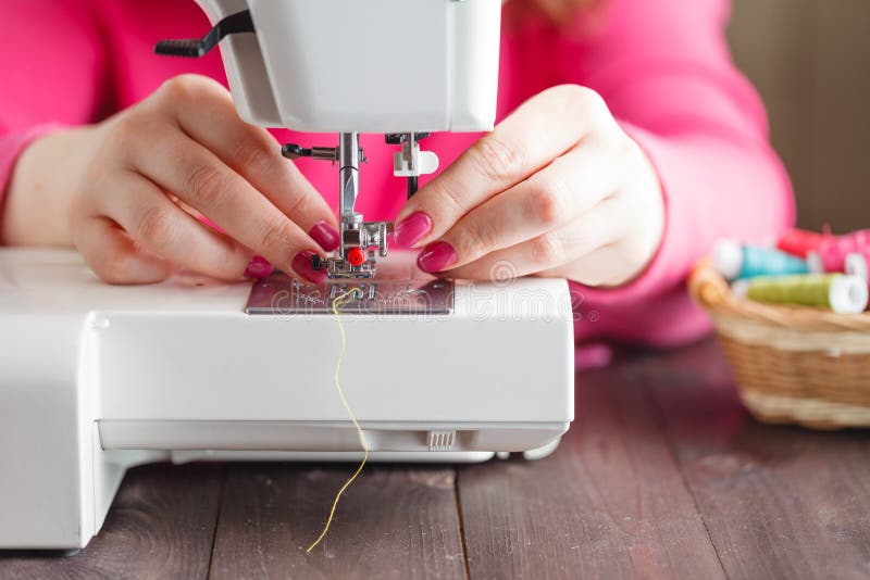 Close-up of Hands Working on a Sewing Machine Stock Photo - Image of ...
