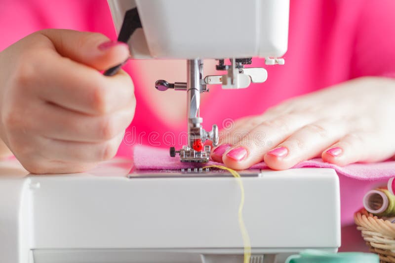 Close-up of Hands Working on a Sewing Machine Stock Image - Image of ...