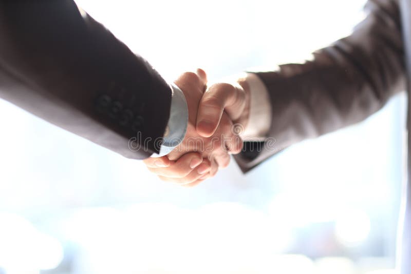 Close Up. Handshake Business Partners on the Background of the Office ... Close Up. Handshake Business Partners on the Background of the Office ...