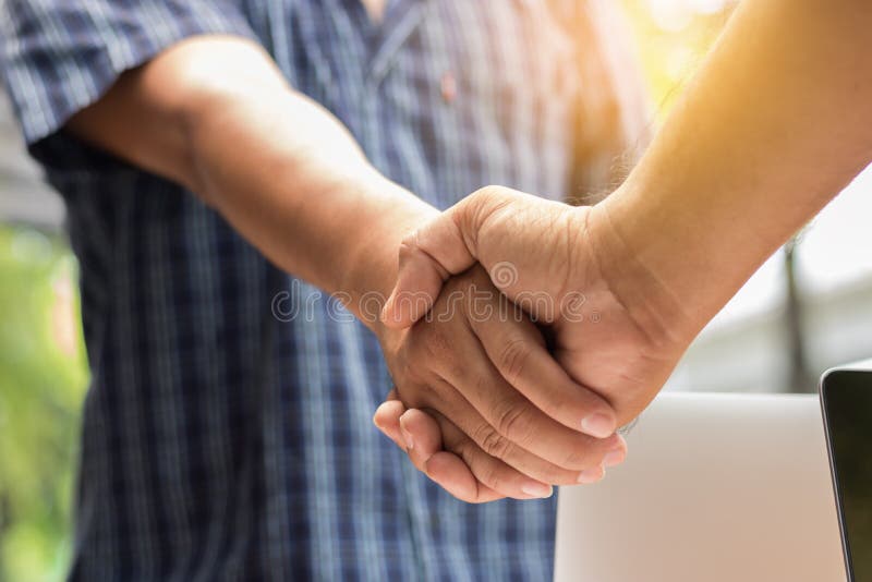 Close Up Businessmen Shaking Hands during a Meeting. Handshake Deal ...