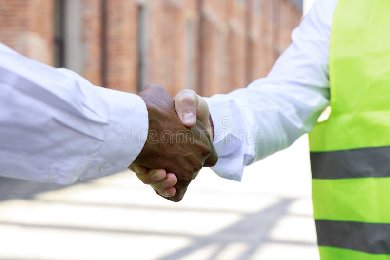 Close Up of Handshake between Caucasian Architect and African American ...