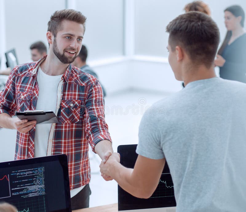 Close Up.handshake of Colleagues Over the Office Table Stock Photo ...