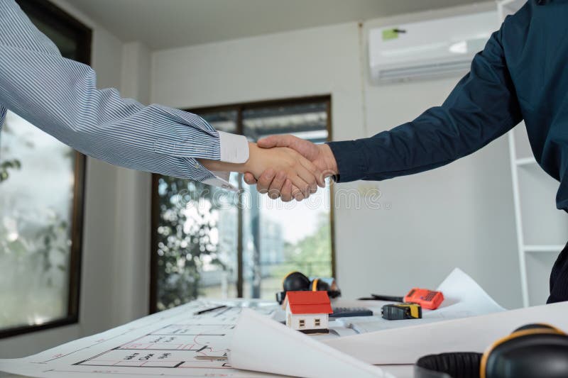 Close-up Handshake between Engineers Finalizing an Architectural ...