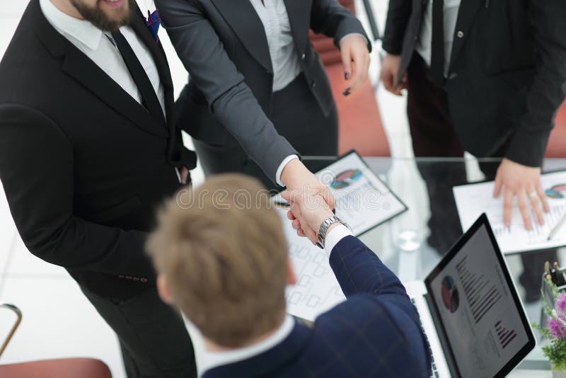 Close Up. Handshake of Trading Partners at the Negotiating Table Stock ...