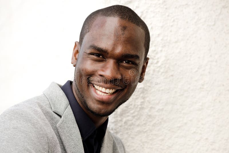 Close Up Handsome African Man Smiling by White Wall Stock Image - Image ...