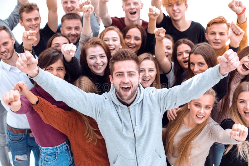 Close Up. Confident Guy Standing among His Friends Stock Photo - Image ...