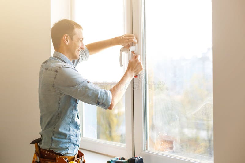Close-up of a Handyman Fixing Window Frame Stock Image - Image of ...