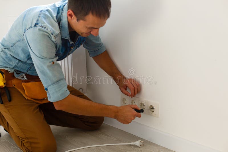 Man Working on Electrical Outlet Stock Image - Image of holding ...