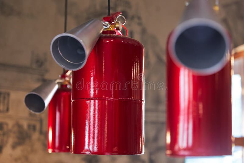 Hanging Red Fire Extinguishers on the Ceiling Stock Image - Image of ...