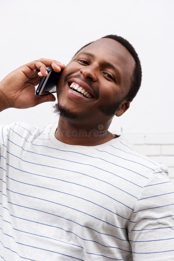 Cool Smiling Young Black Man Looking at Mobile Phone Stock Image ...