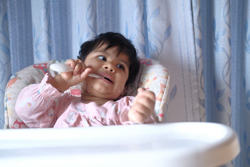 Close Up of Happy Child Sitting on High Chair Stock Image - Image of ...