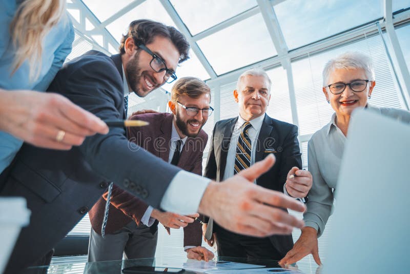 Close Up. Happy Employees Looking at the Laptop Screen Stock Image ...