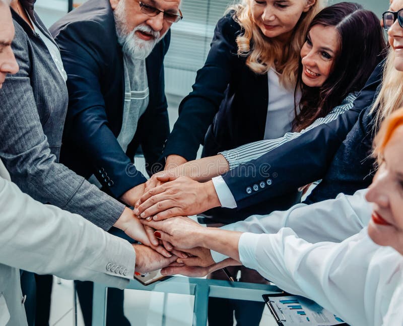 Close Up. Happy Group of Employees Making a Stack of Hands Stock Image ...