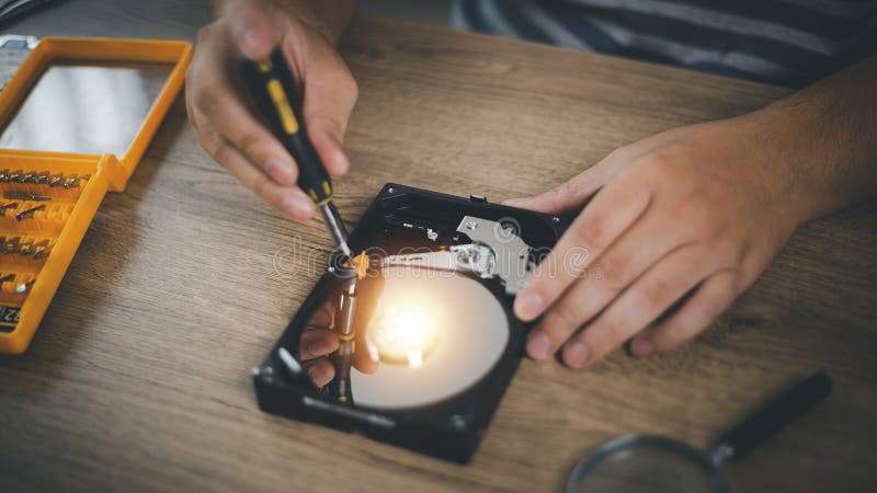 Close Up of Hard Disk Internal Mechanism Hardware. HDD in Hand with a ...
