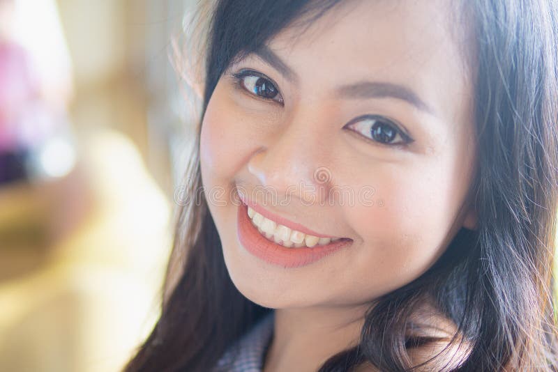 A Close Up Head Shot Portrait of Young Asian Woman Smiling Happily ... A Close Up Head Shot Portrait of Young Asian Woman Smiling Happily ...