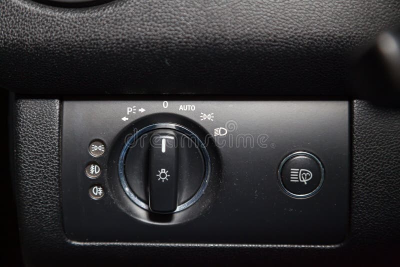 Close-up on the Headlight Switch Control Buttons and Automatic Adjust ...