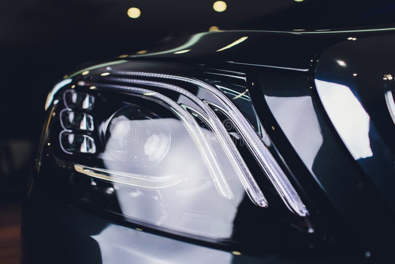 Close Up Headlights Front Side View , Black Color Car in Room. Stock ...
