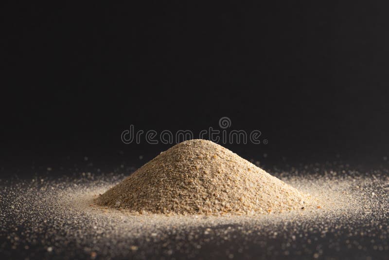 Close Up of Heap of Sand and Copy Space on Black Background Stock Photo ...