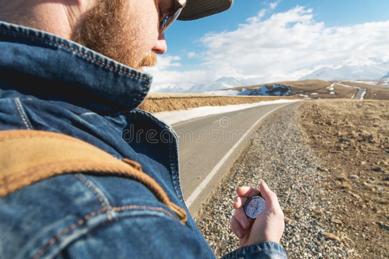 Close-up Hipster Man Using a Compass on a Snowy Mountain Stock Photo ...