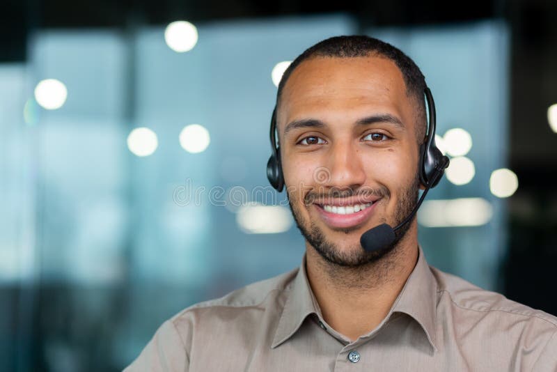 Close Up Hispanic Male Worker with Video Headset Smiling and Looking at ...